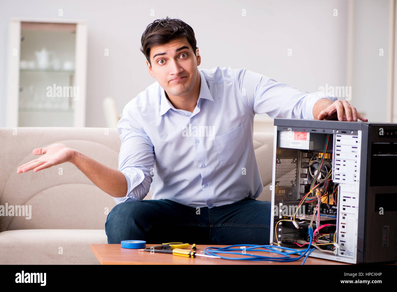 Frustrated man with broken pc computer Stock Photo - Alamy