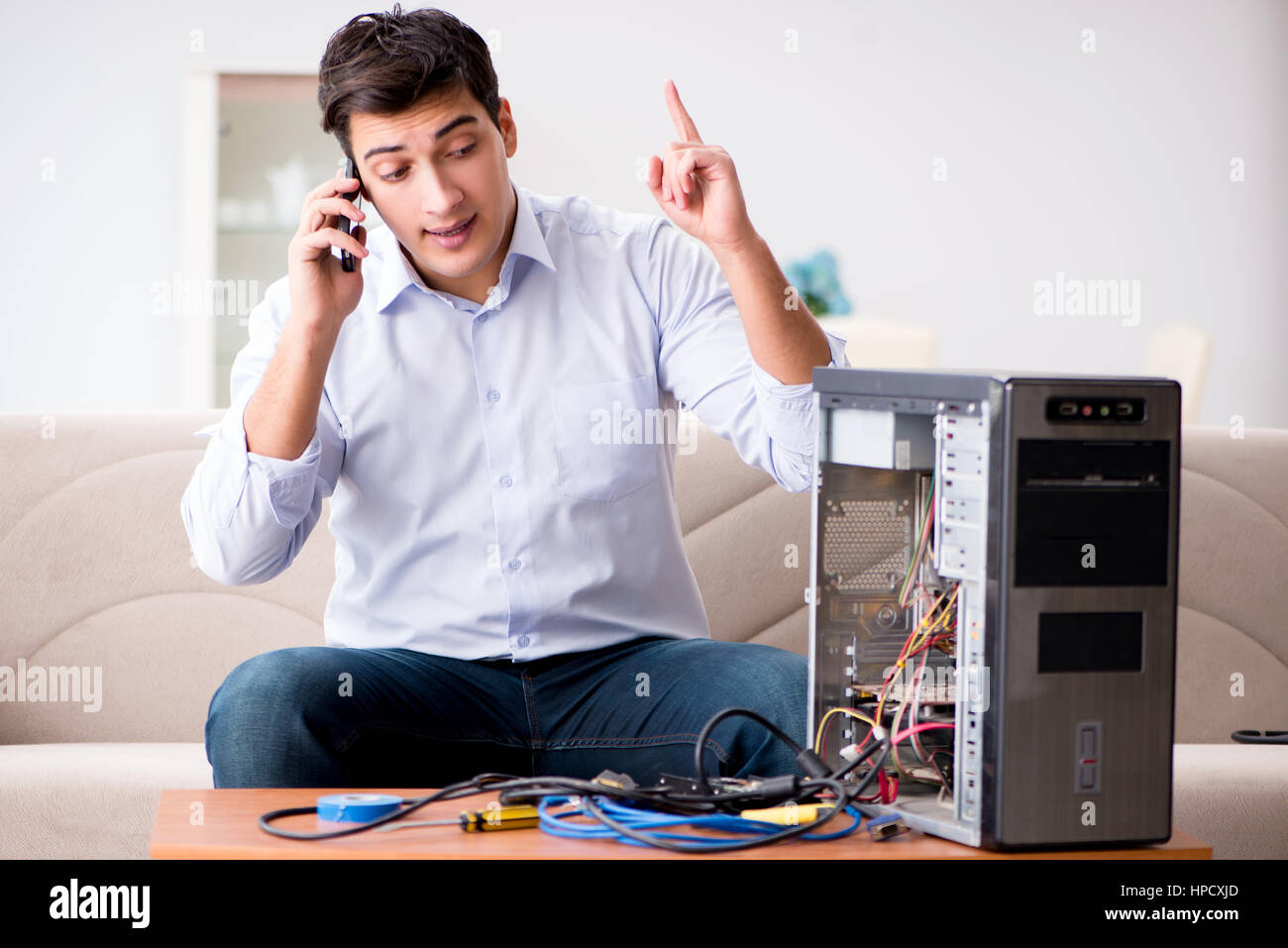 Happy customer resolving his computer problem Stock Photo - Alamy