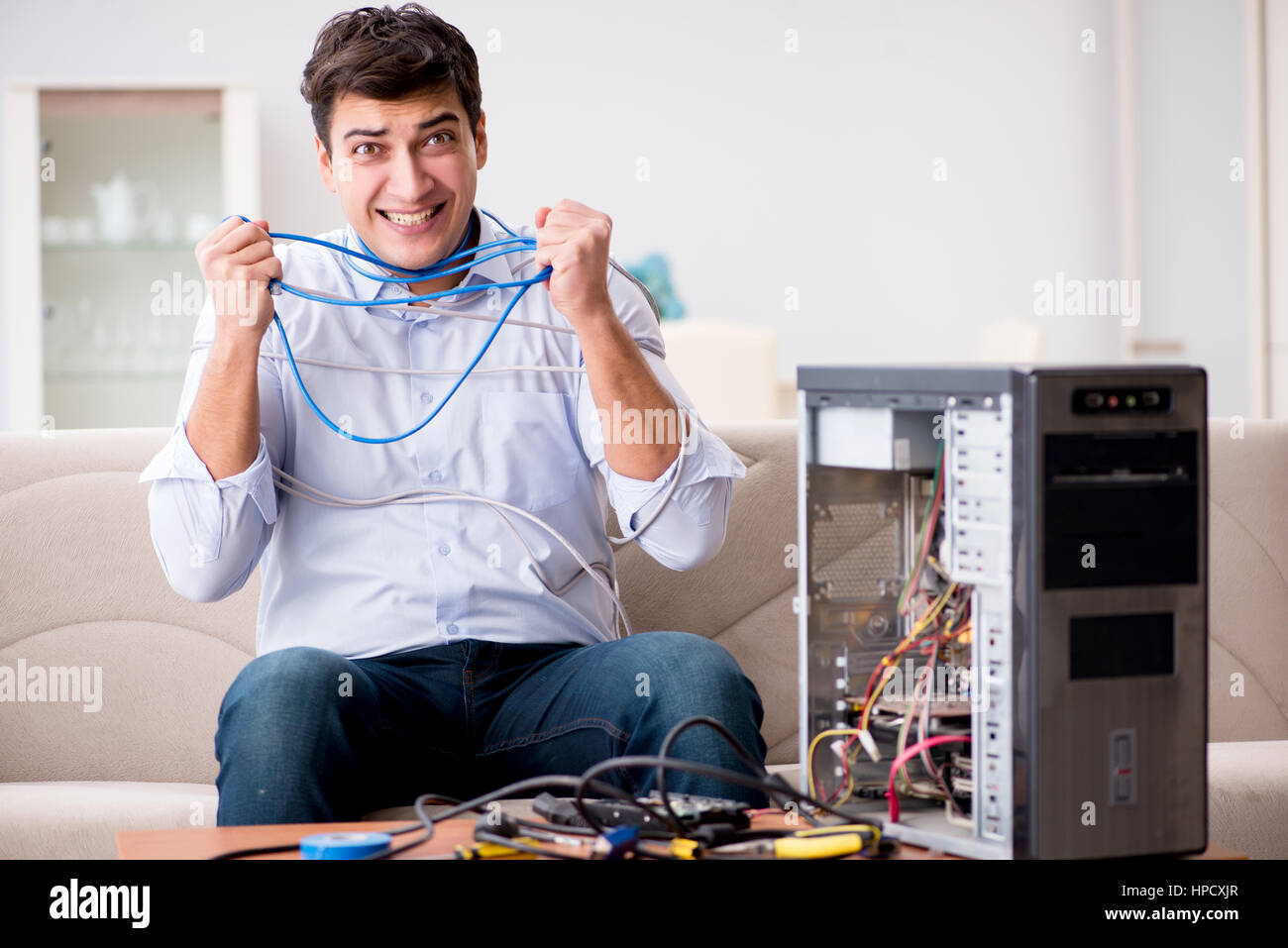 Frustrated man with broken pc computer Stock Photo - Alamy
