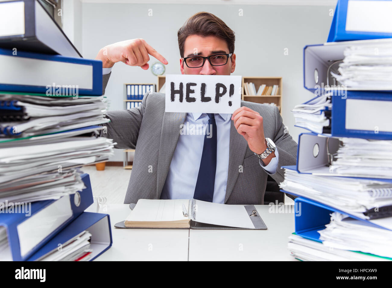 Busy businessman asking for help with work Stock Photo - Alamy