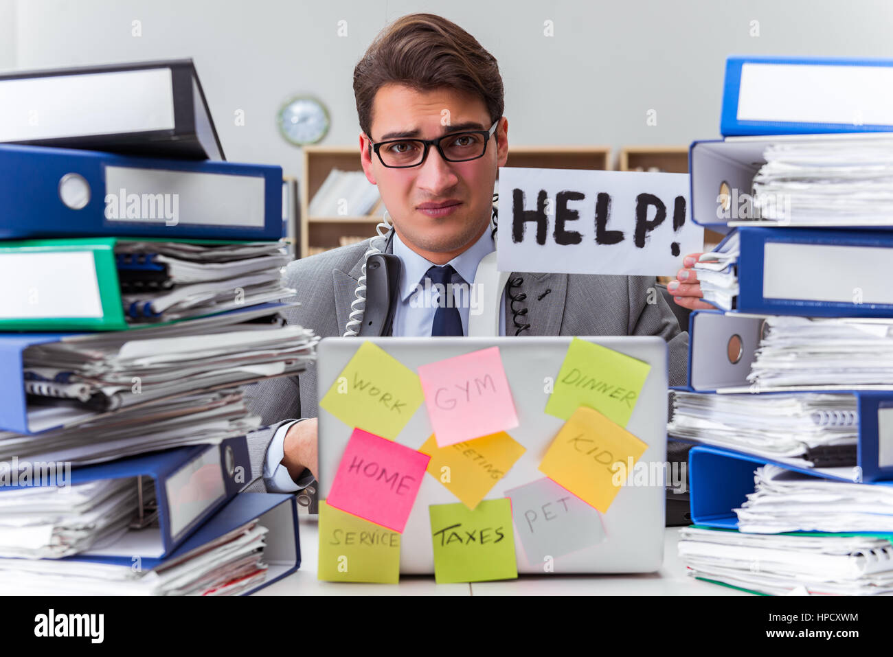 Busy businessman asking for help with work Stock Photo - Alamy