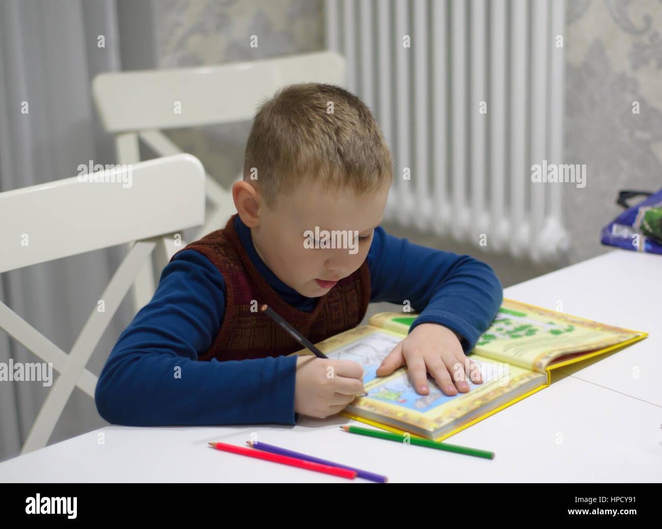 Sitting reading book concentration education table hi-res stock ...