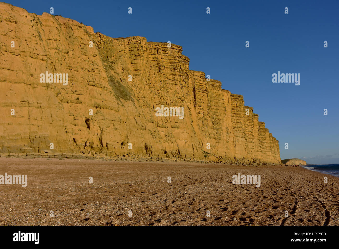 Landscape of deteriorating jurassic coast cliffs and blue clear sky ...