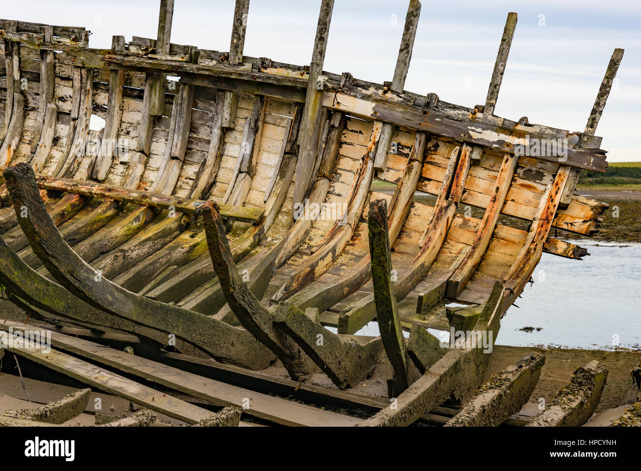 Decaying boat wreck in the Afon Goch Estuary near Dulas, Anglesey ...