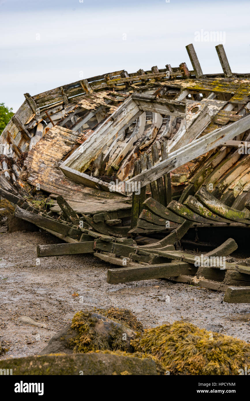 Decaying boat wreck in the Afon Goch Estuary near Dulas, Anglesey ...