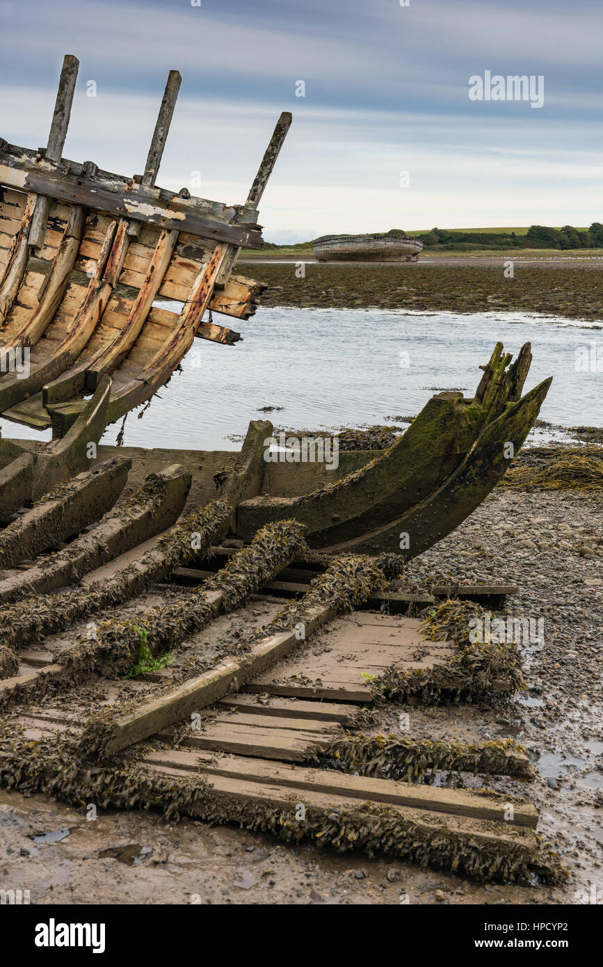 Two decaying boat wrecks in the Afon Goch Estuary near Dulas, Anglesey ...