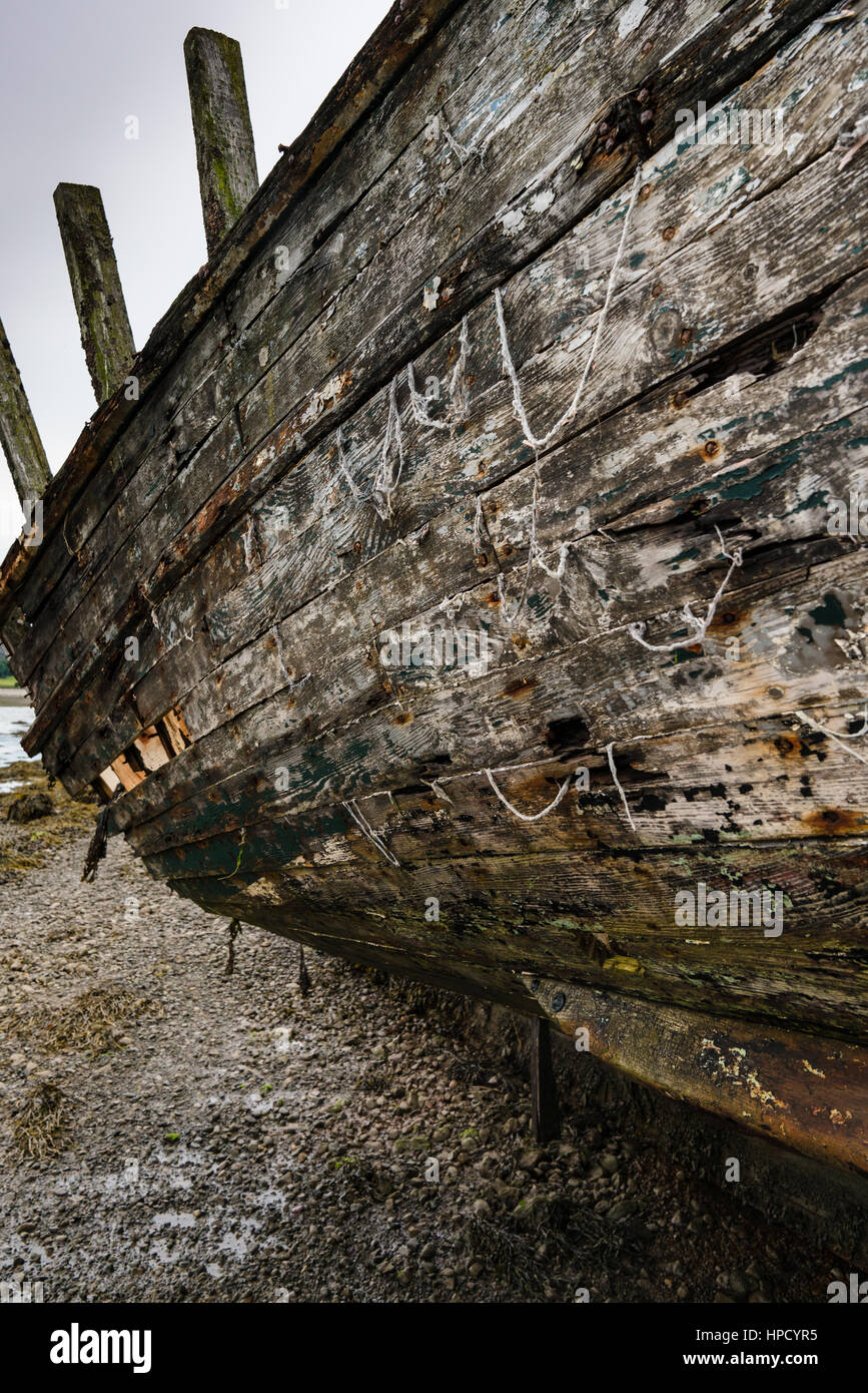 The hull of a decaying boat wreck in the Afon Goch Estuary near Dulas ...