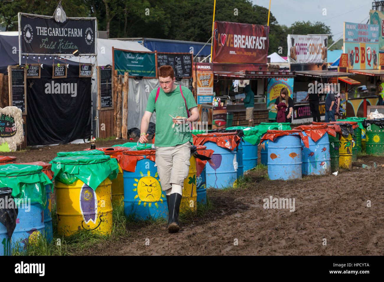 David Vickers making his way through the mud during the Glastonbury ...