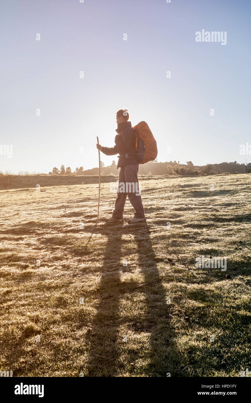 Side view of female hiker at sunrie Stock Photo - Alamy