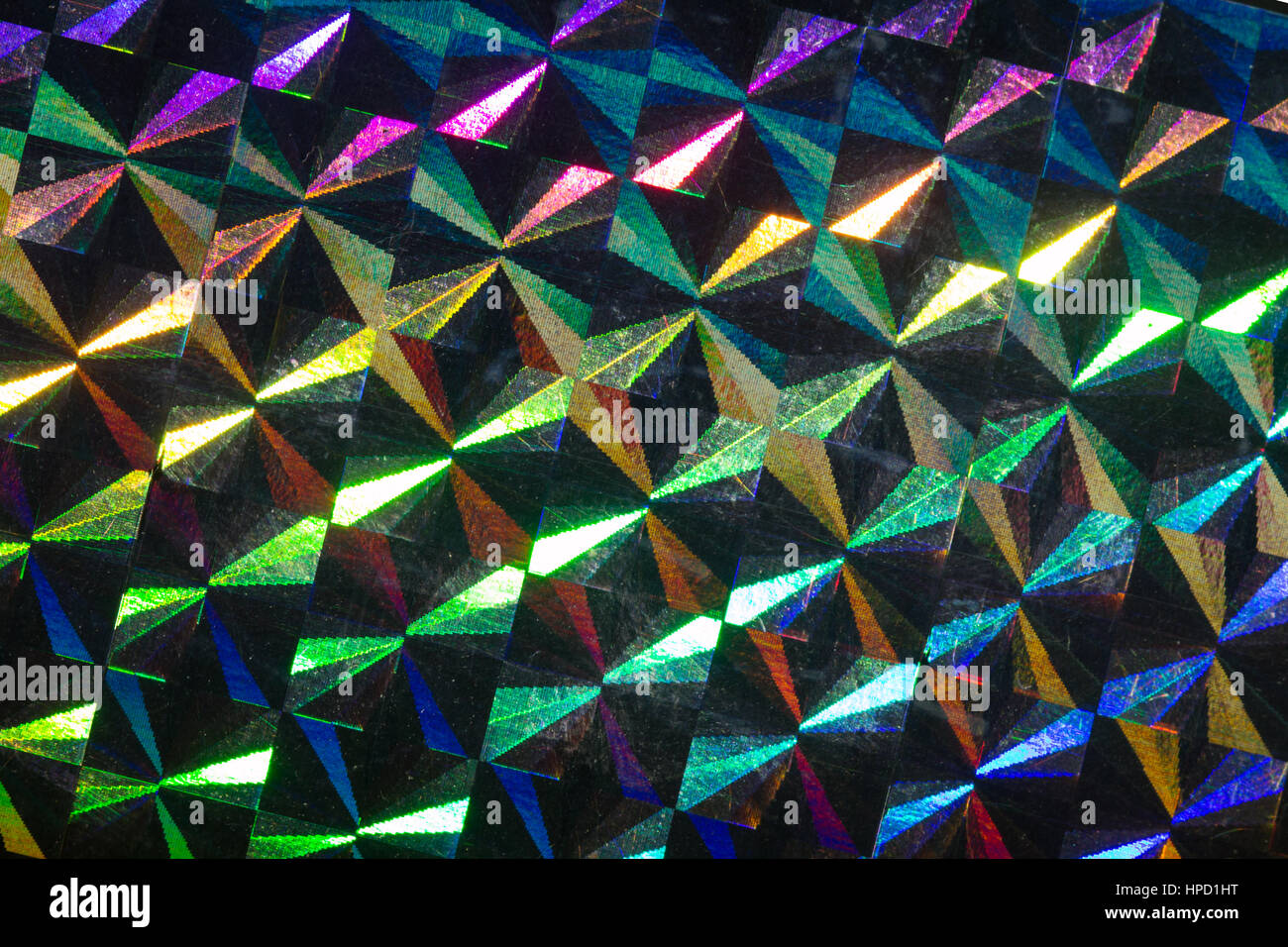 Psychedelic abstract formed by light reflecting off a textured metal ...