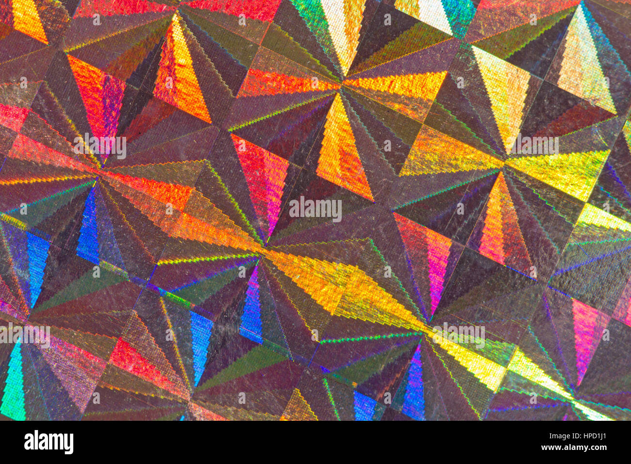 Psychedelic abstract formed by light reflecting off a textured metal ...