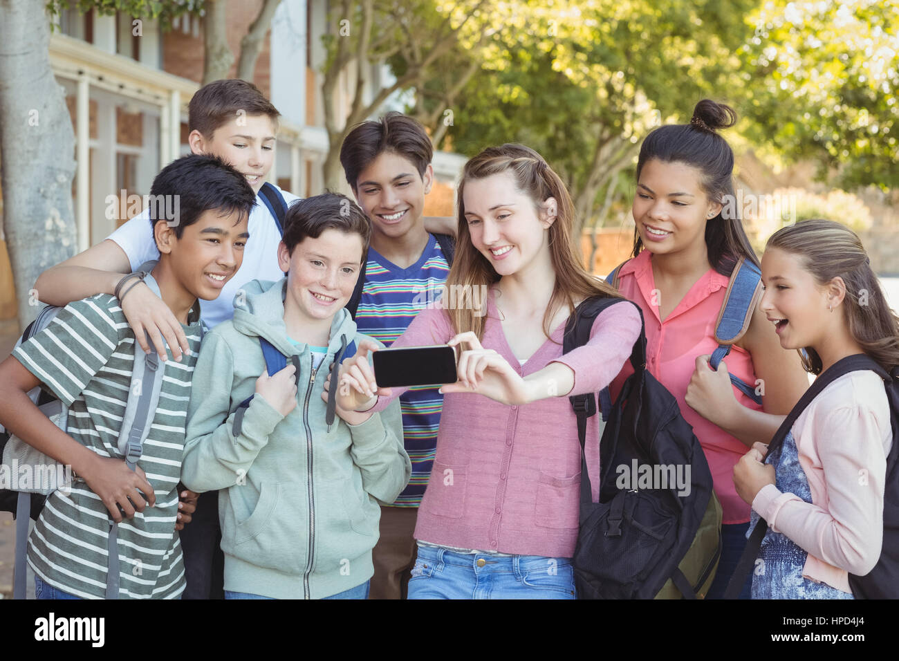 Girl and boy see photos phone hi-res stock photography and images - Alamy