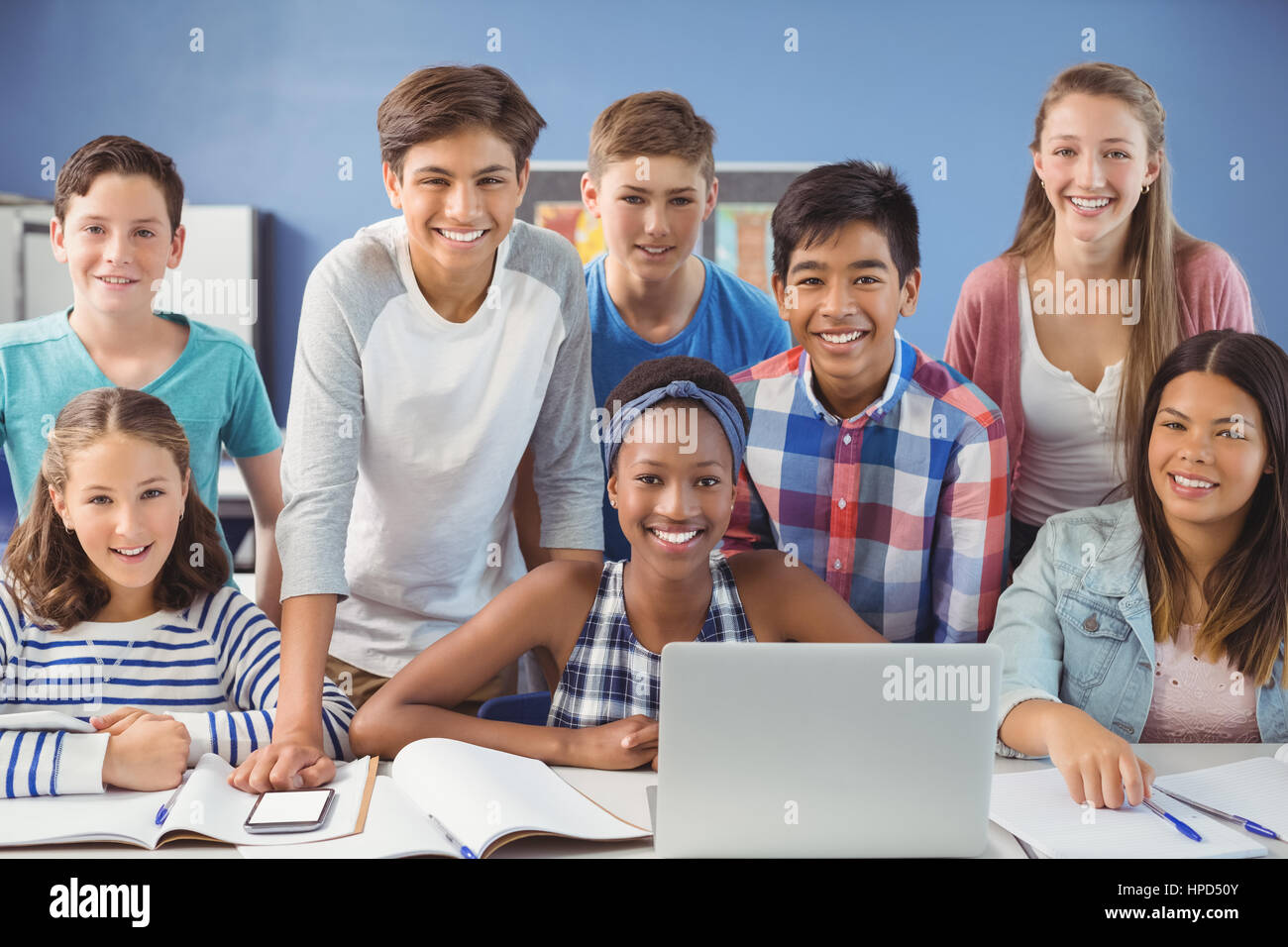 Group of students using laptop in classroom at school Stock Photo - Alamy