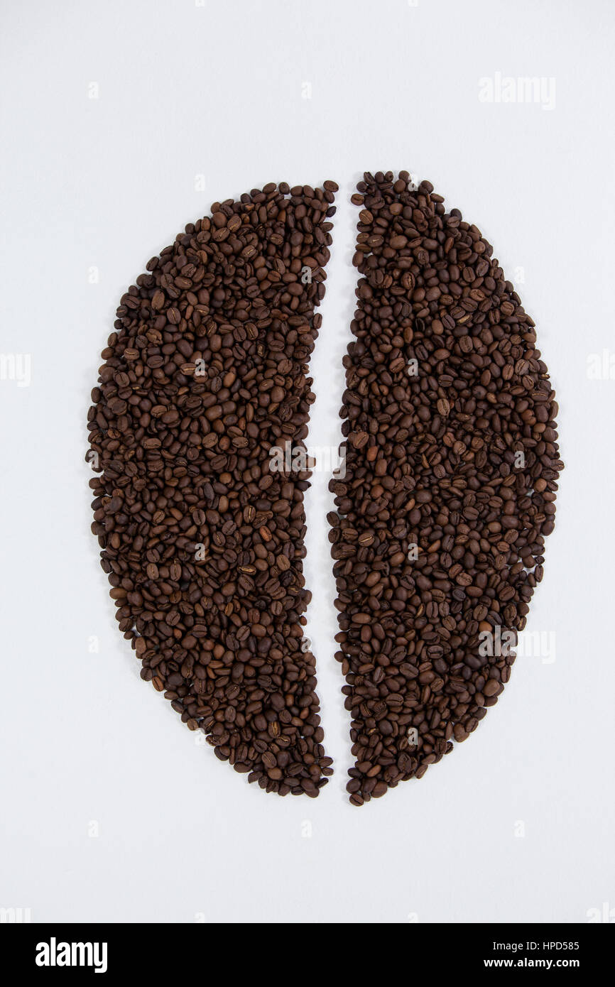 Coffee beans forming coffee bean shape on white background Stock Photo ...