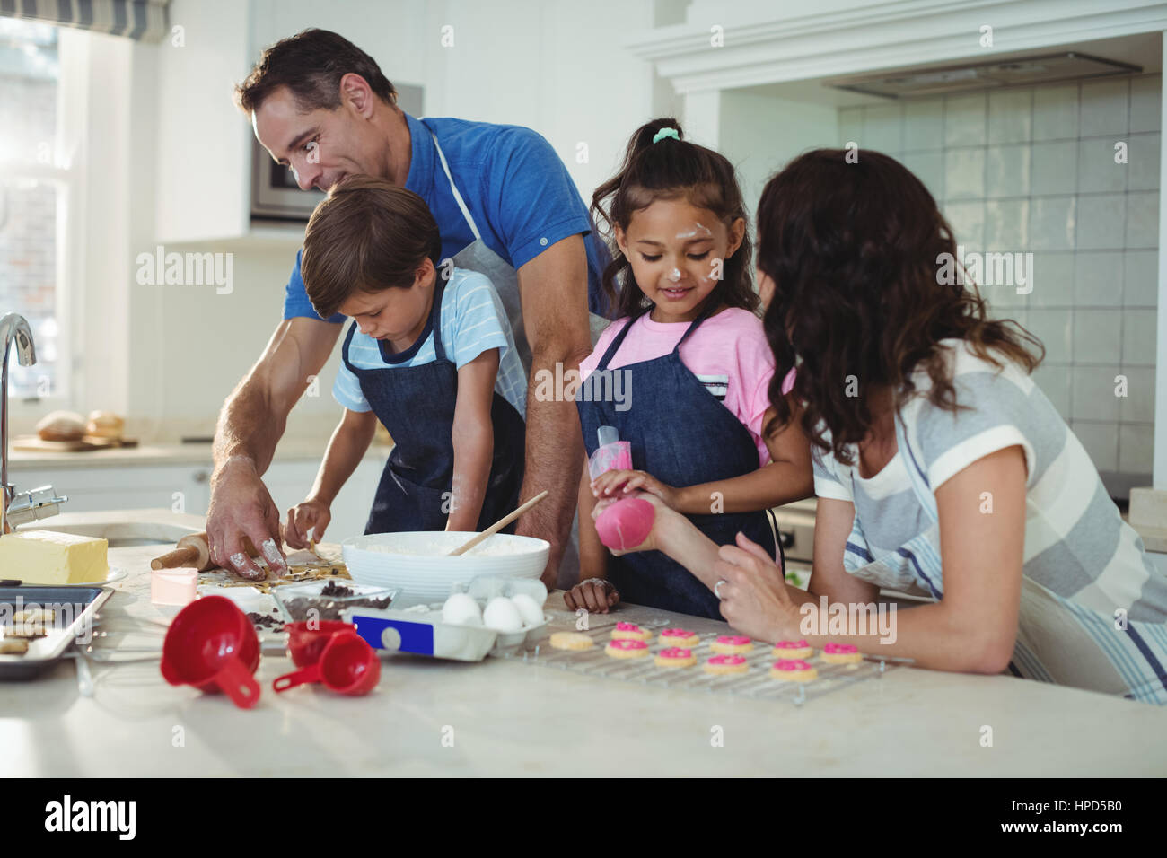Boy mixing chocolate in kitchen hi-res stock photography and images - Alamy