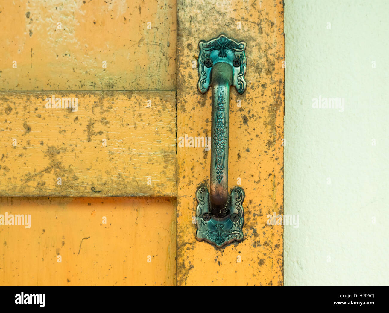 Old metal handle with the flower pattern on the wooden window Stock ...