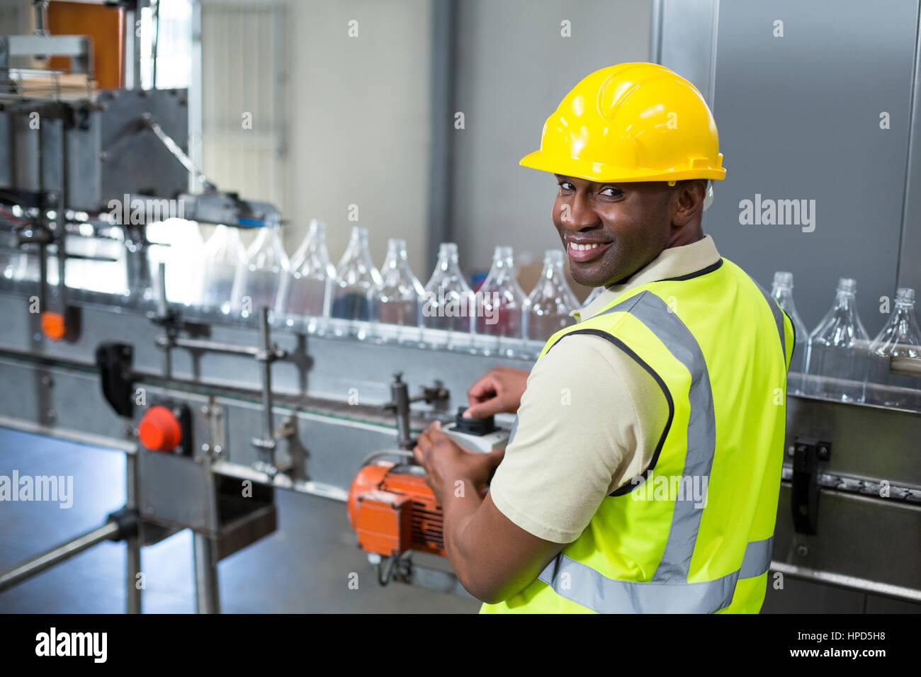 Smiling worker in manufacturing plant hi-res stock photography and ...