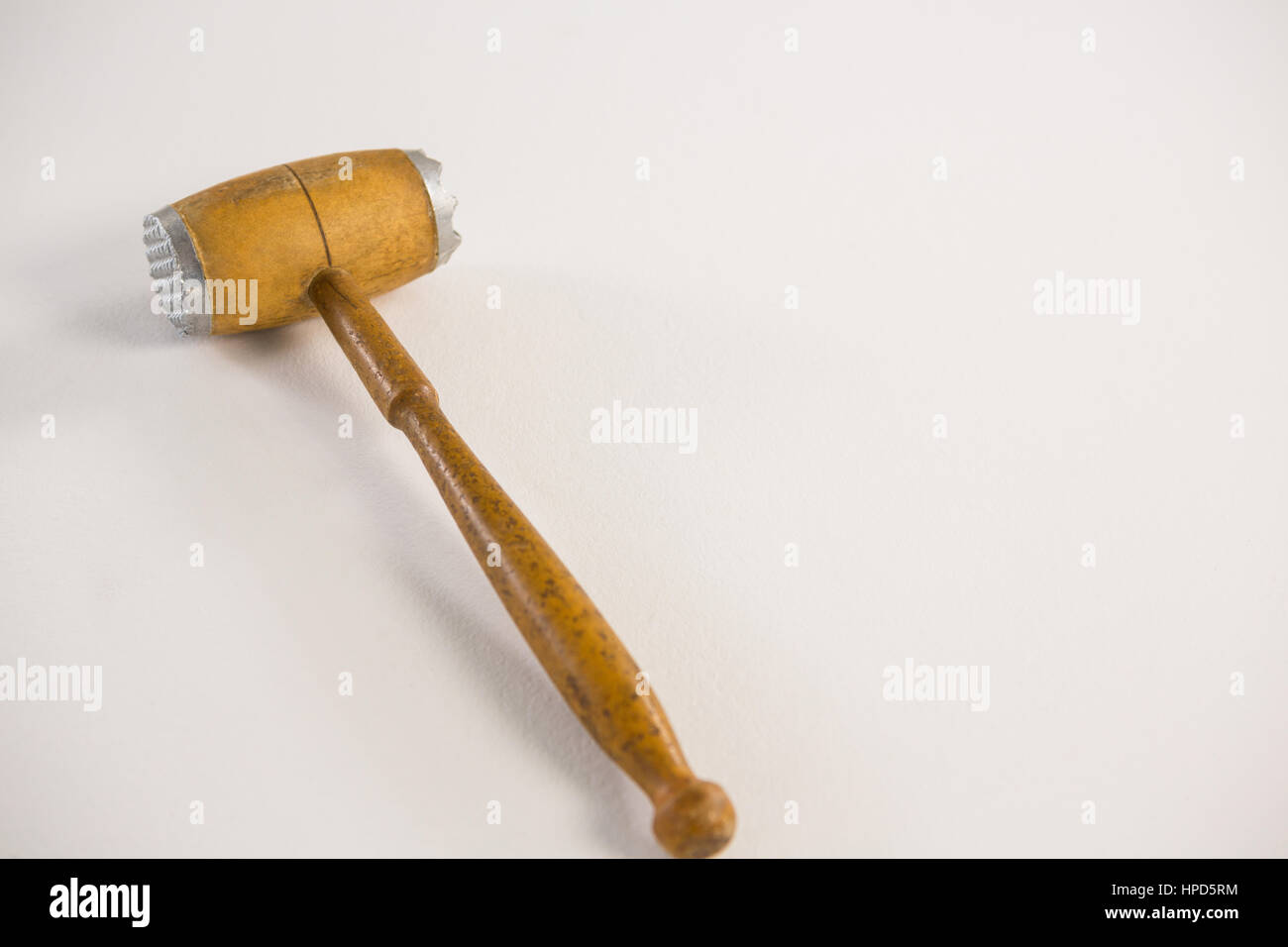Meat cutting hammer against white background Stock Photo - Alamy