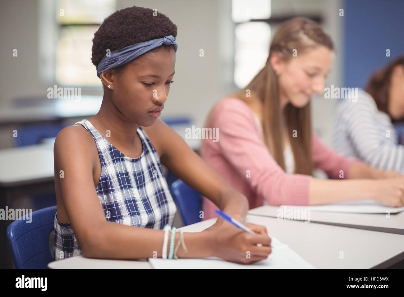 Students studying in classroom at school Stock Photo - Alamy