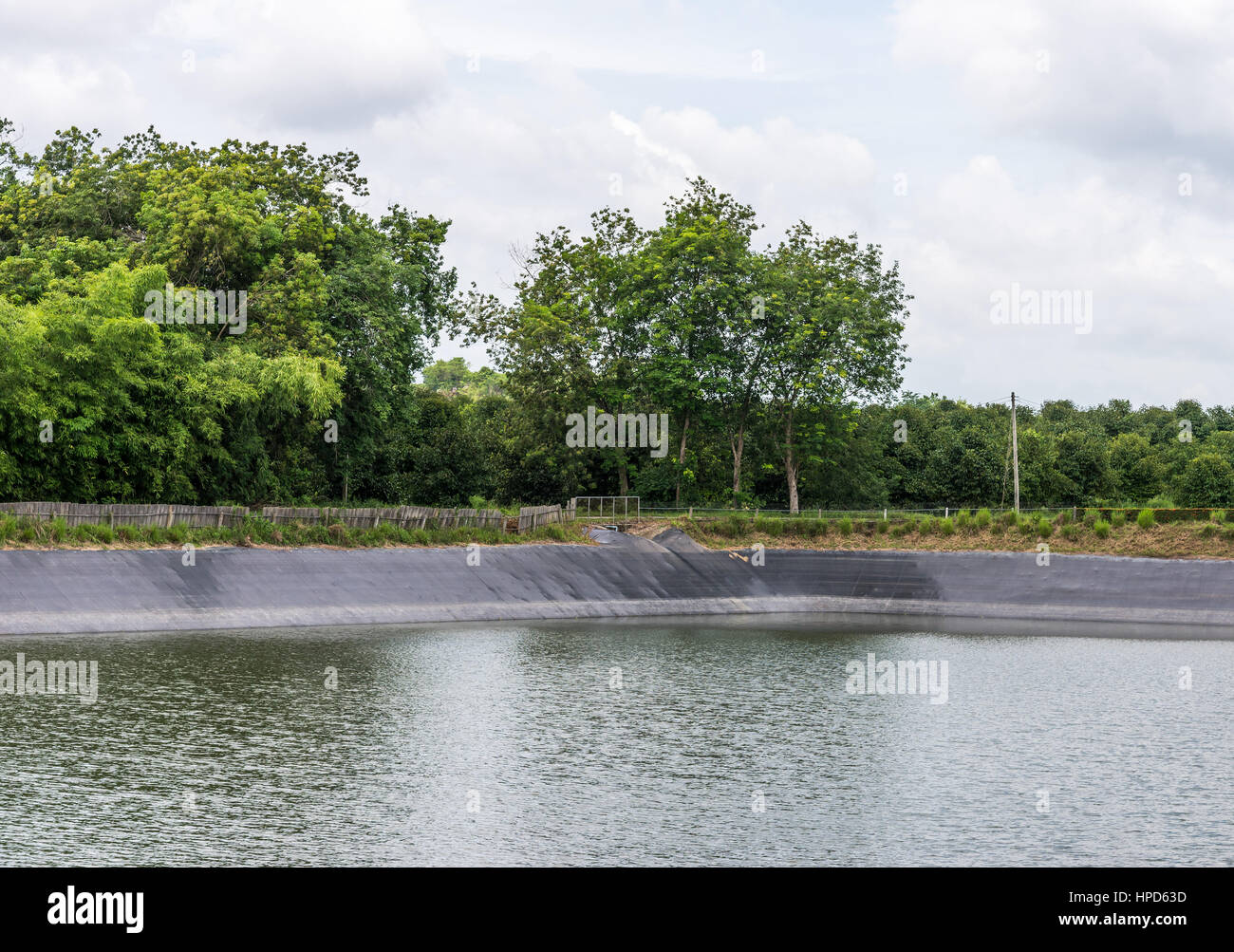 Small reservoir with the plastic sheet in the countryside farm Stock ...