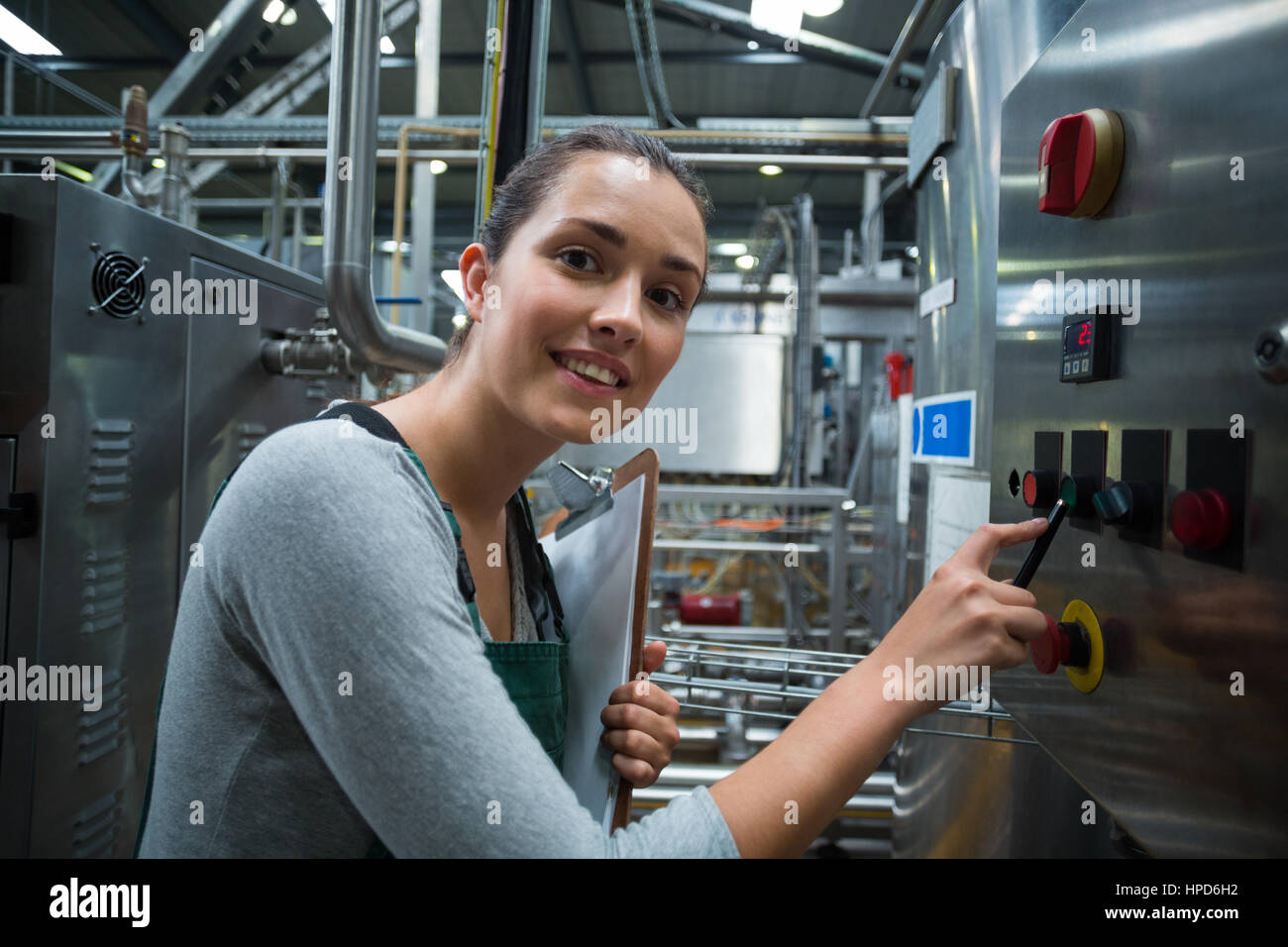 Woman Factory Worker Operating Machine High Resolution Stock ...