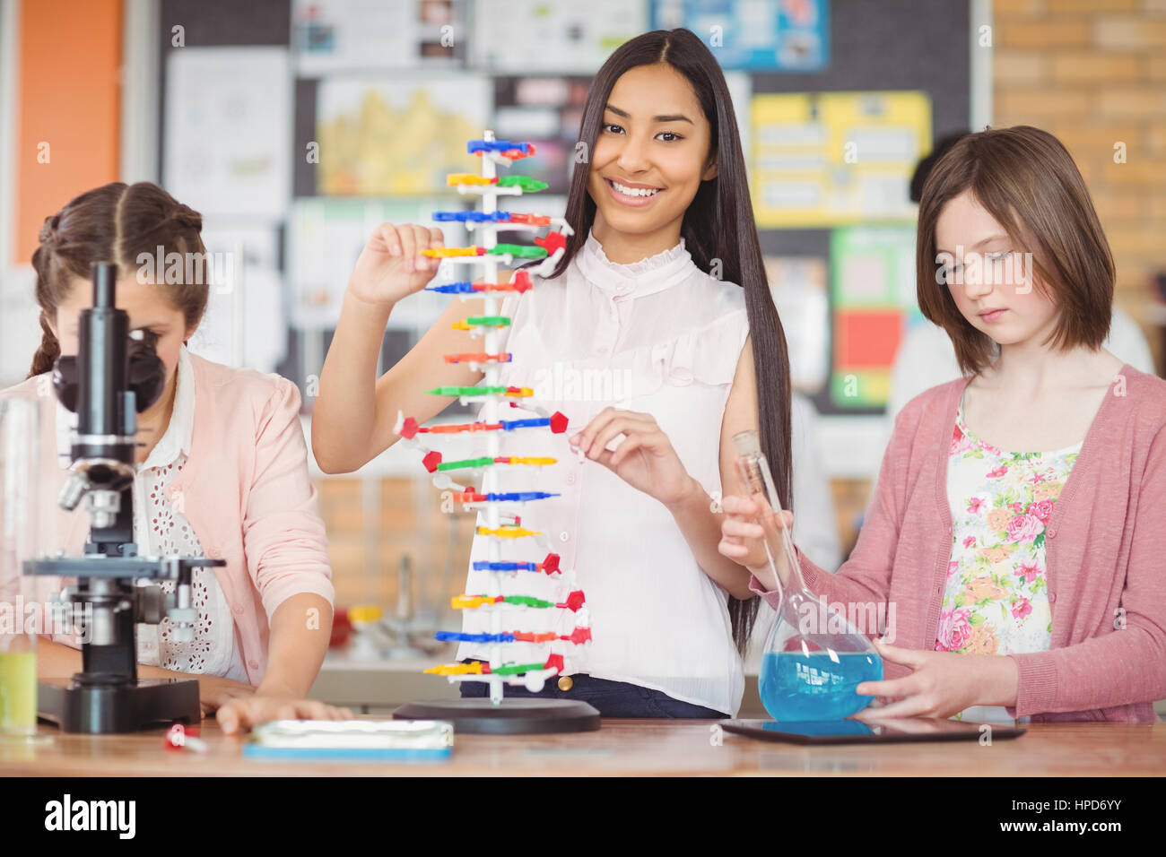 Students experimenting molecule model in laboratory at school Stock ...