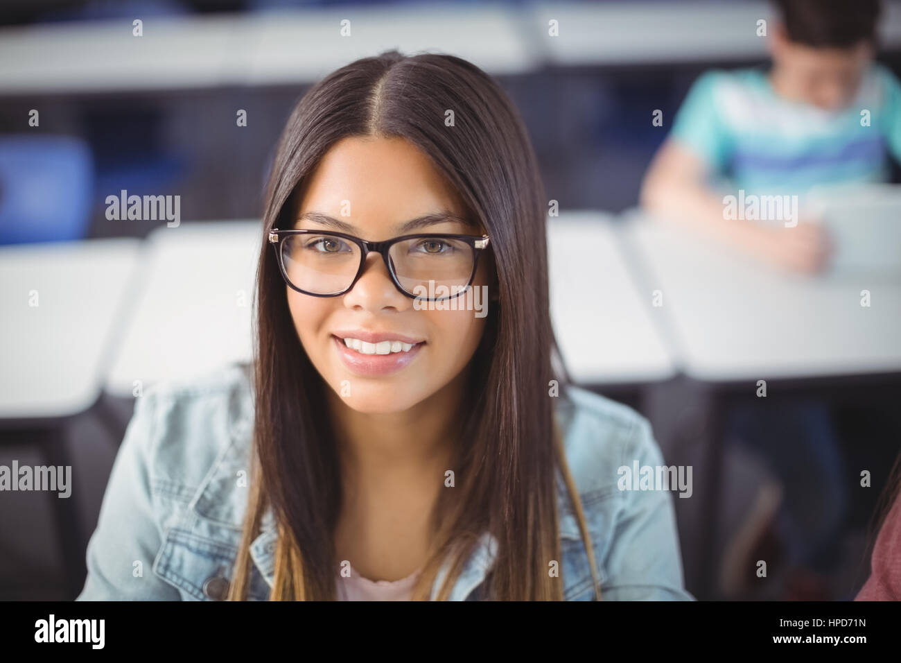 Portrait of smiling schoolgirl in school Stock Photo - Alamy