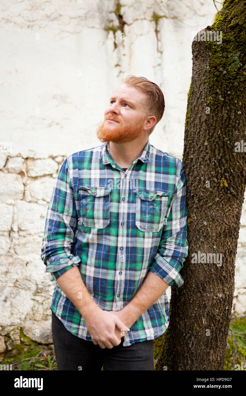 Portrait of red haired man with plaid shirt and long beard Stock Photo ...