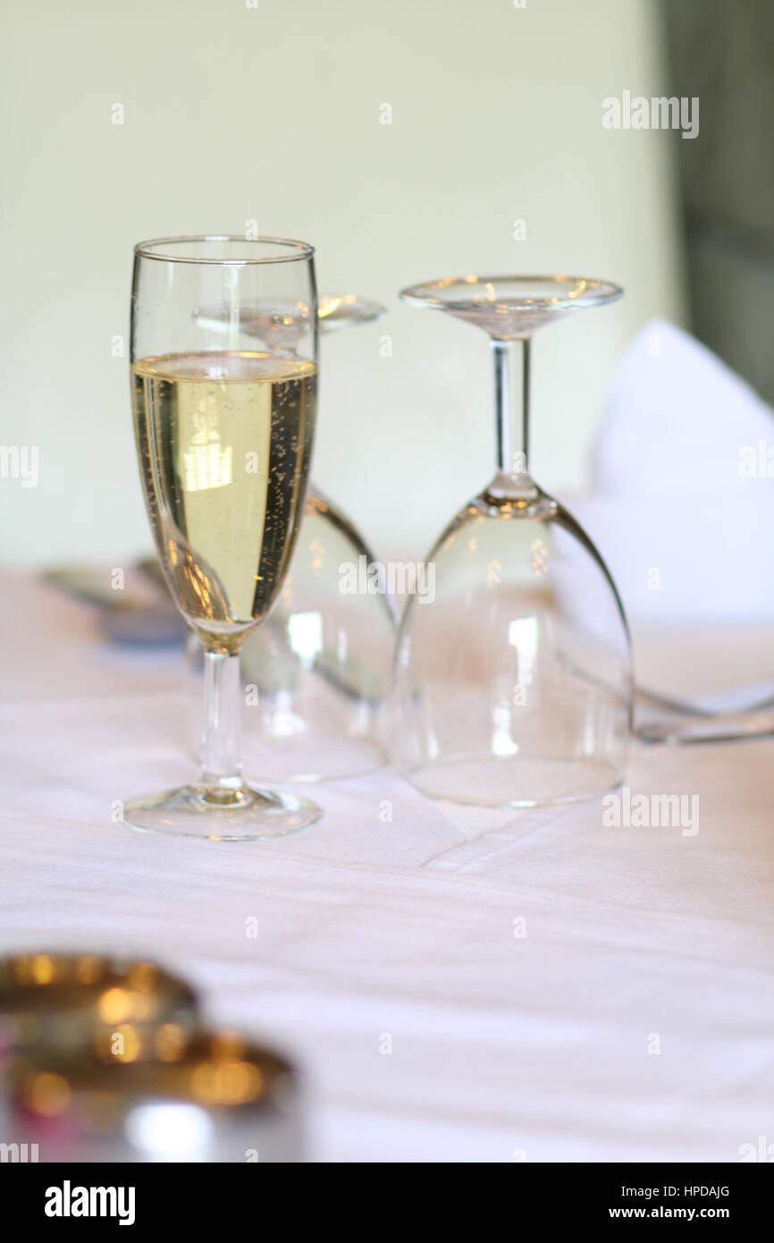 Glass of champagne on table Stock Photo - Alamy