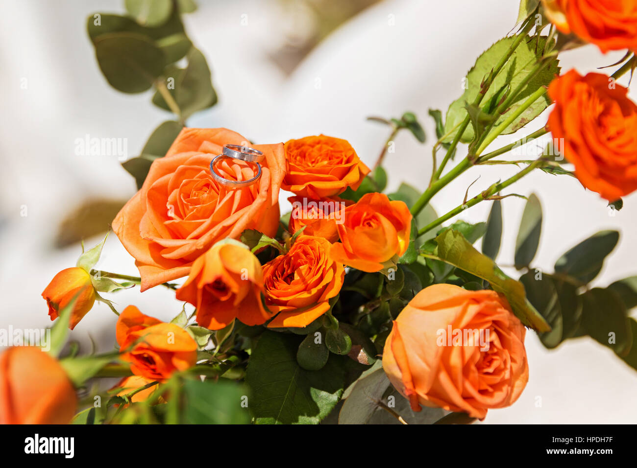 Bouquet of beautiful roses and wedding rings Stock Photo - Alamy