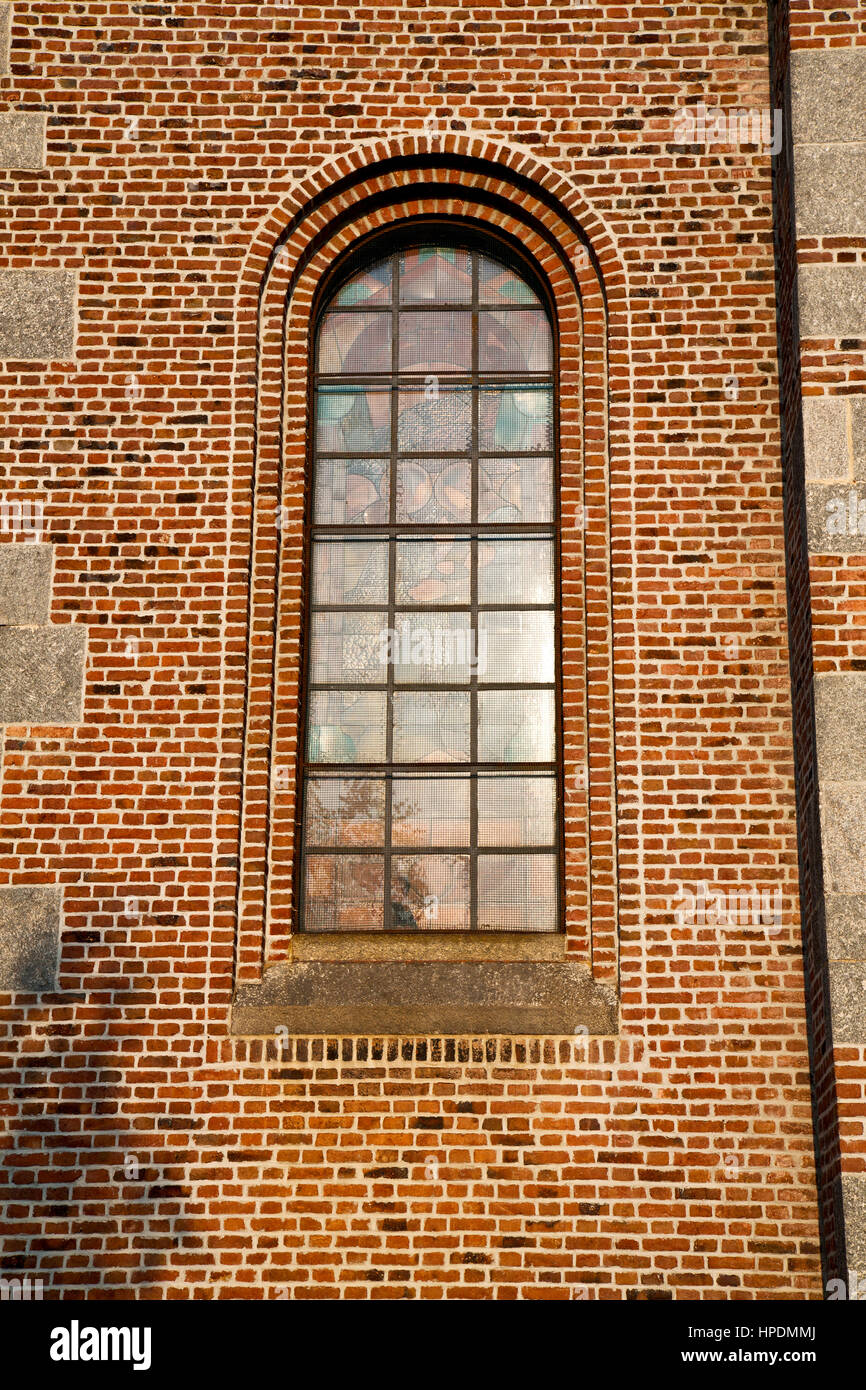 italy lombardy in the turbigo old church closed brick tower wall rose ...