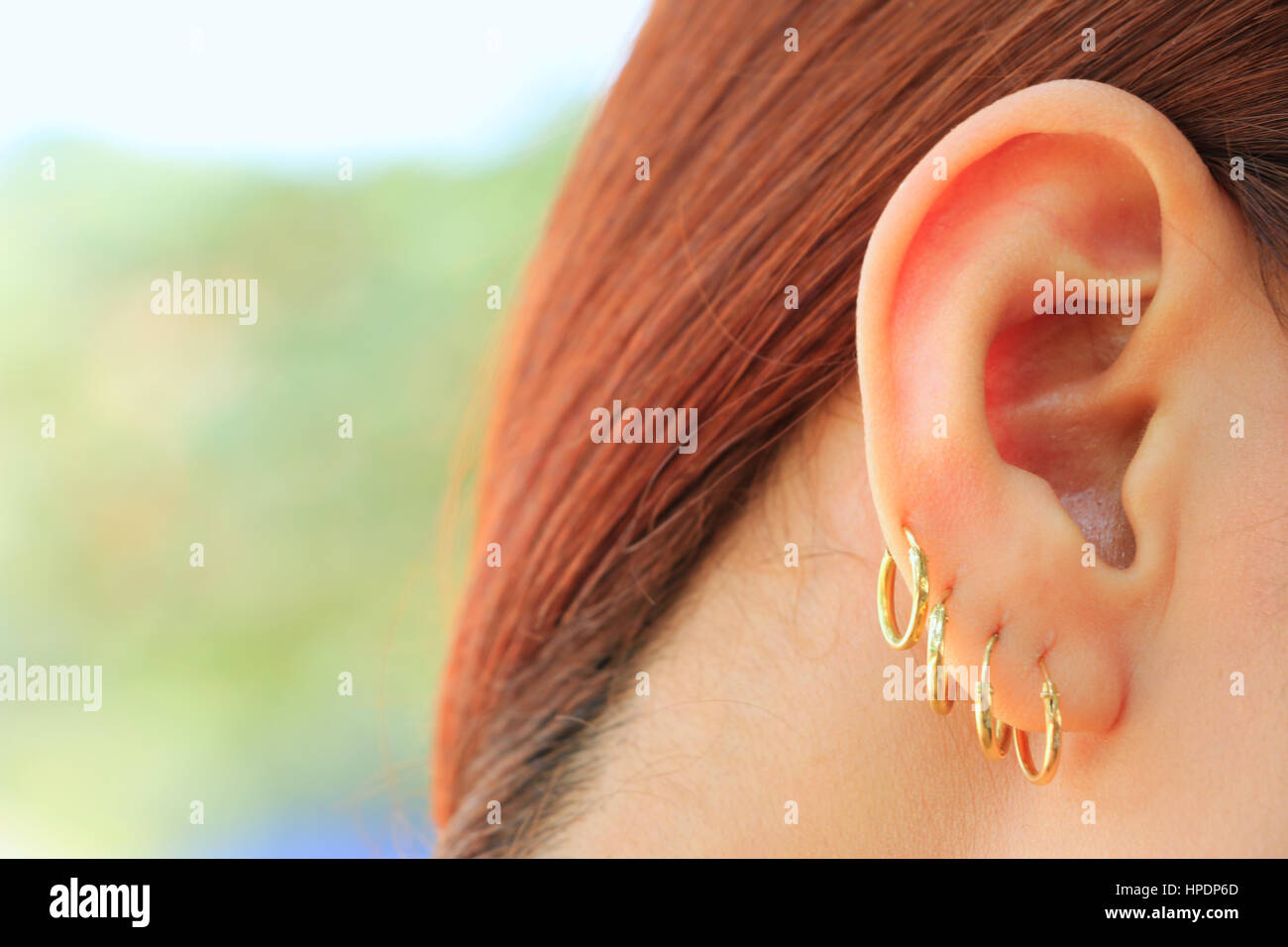 Beautiful south east asia women ear with decorations Stock Photo - Alamy
