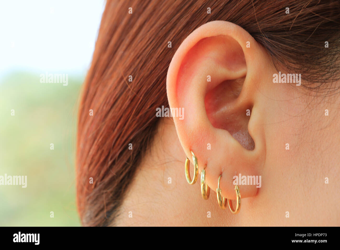Beautiful south east asia women ear with decorations Stock Photo - Alamy