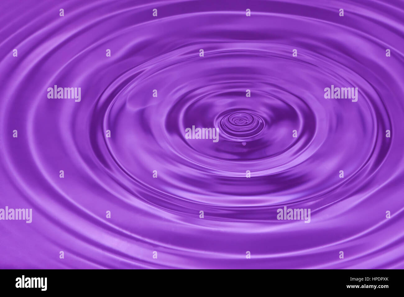 Purple water ripple abstract background Stock Photo - Alamy