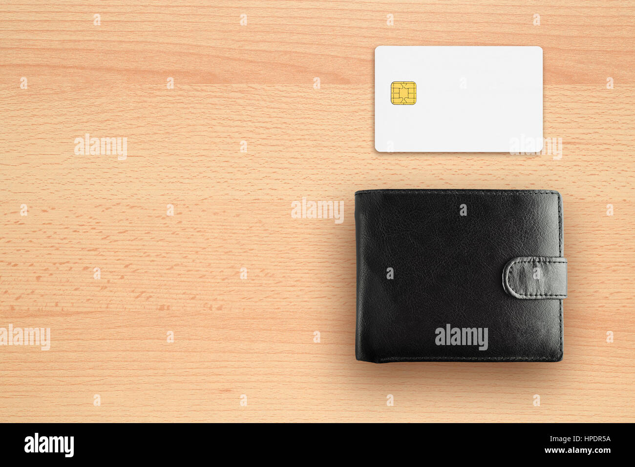 Credit card and wallet on desk Stock Photo - Alamy