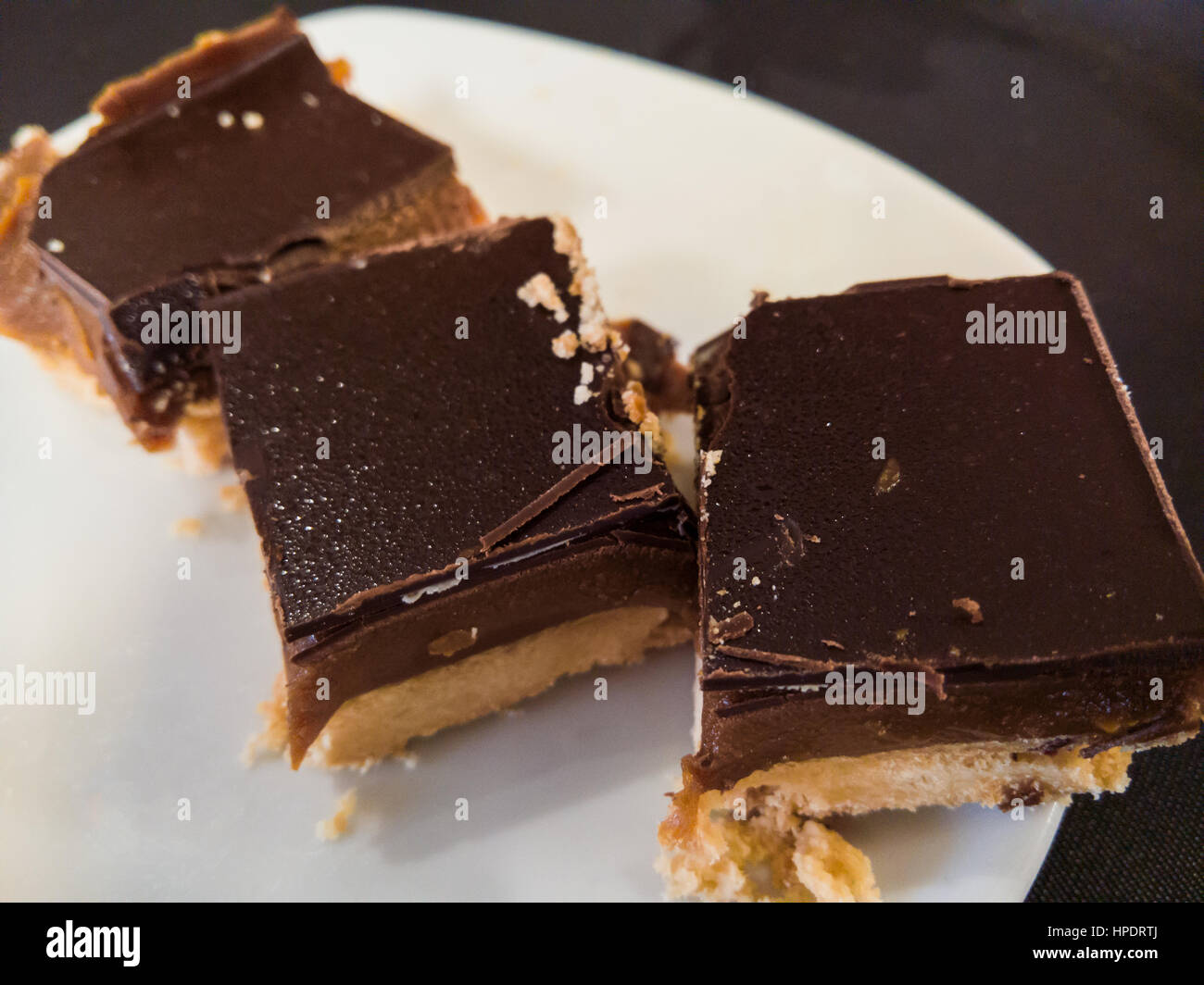 Caramel Shortbread, or Millionaires Shortbread, on a plate Stock Photo ...