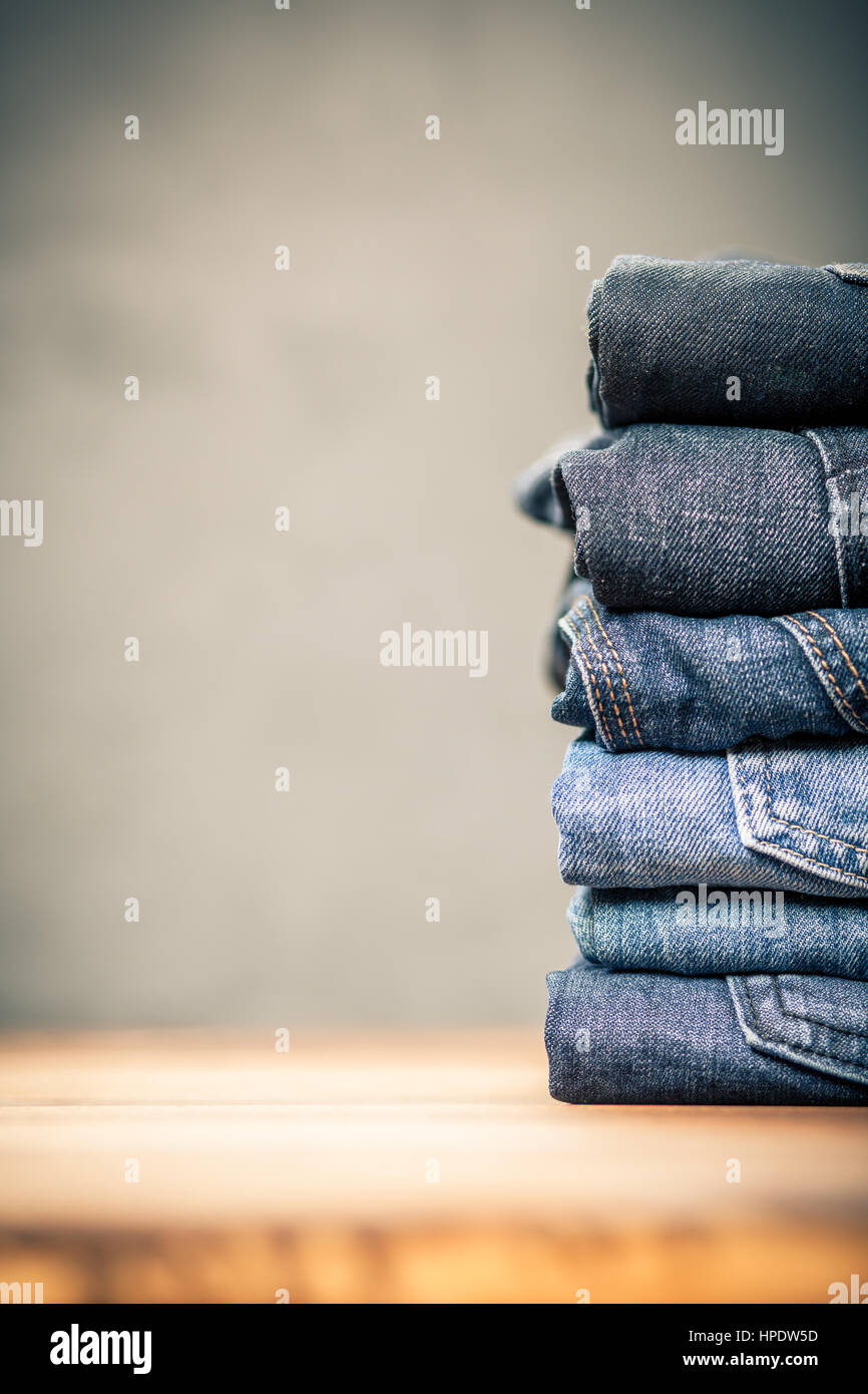 Jeans arranged in a stack Stock Photo - Alamy