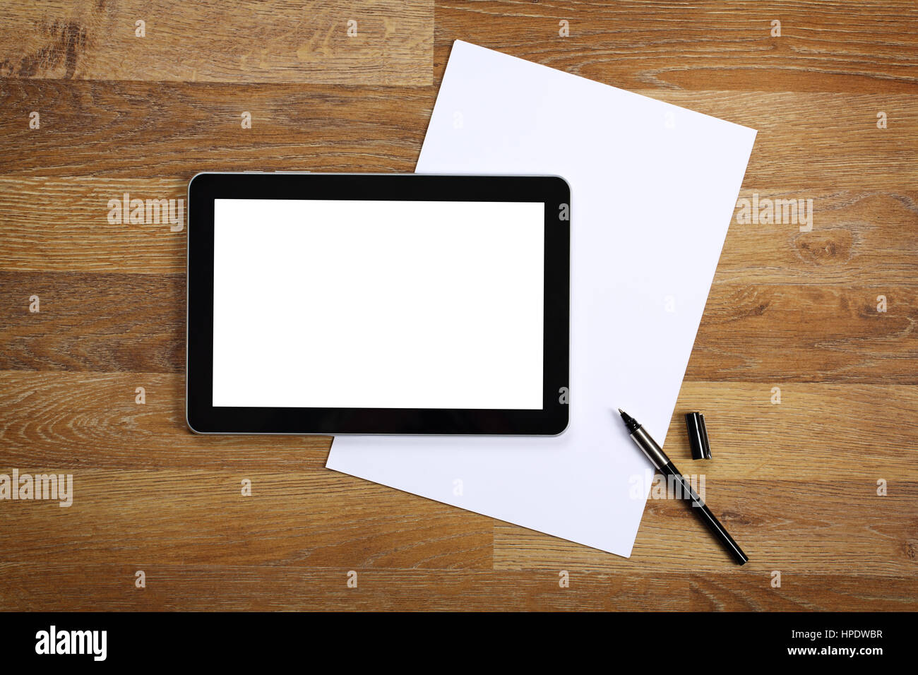 Modern generic tablet with blank screen on wooden table Stock Photo - Alamy