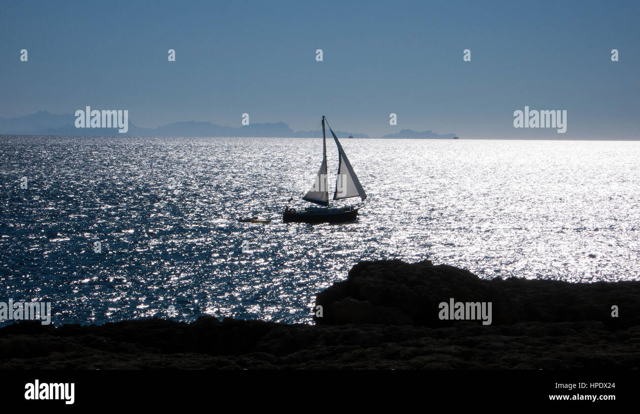 Coastal view of Majorca (background) from Cala Blanca, Menorca ...