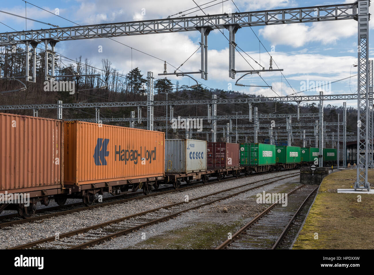 Freight train on railroad loaded with cargo containers Stock Photo - Alamy