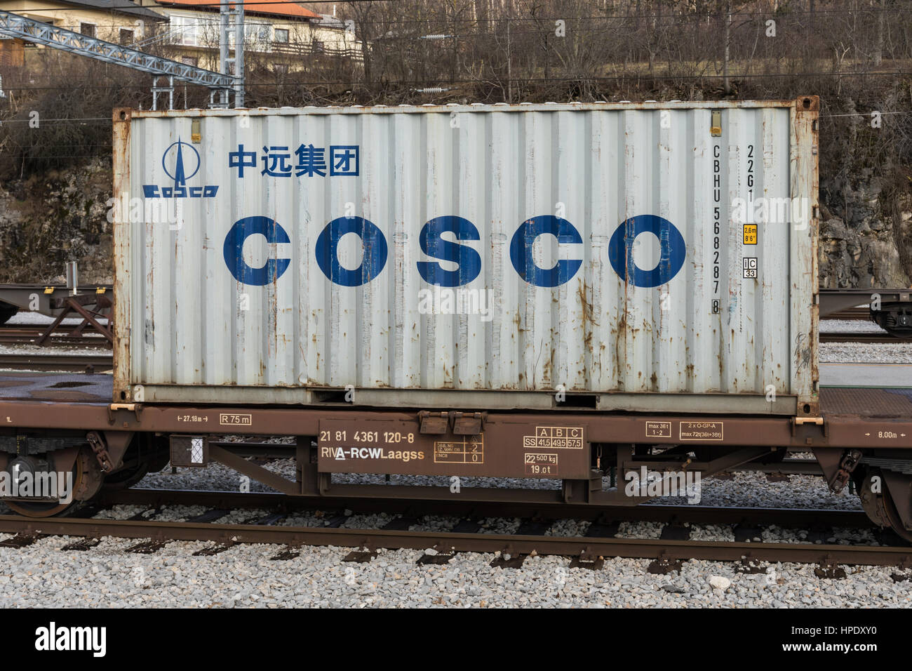 Freight train on railroad loaded with Cosco cargo container Stock Photo ...