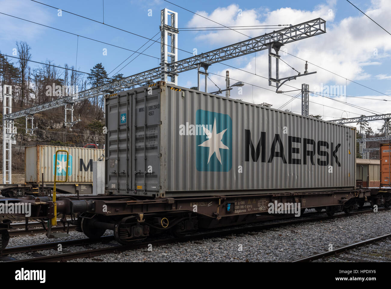 Freight train on railroad loaded with Maersk cargo container Stock ...