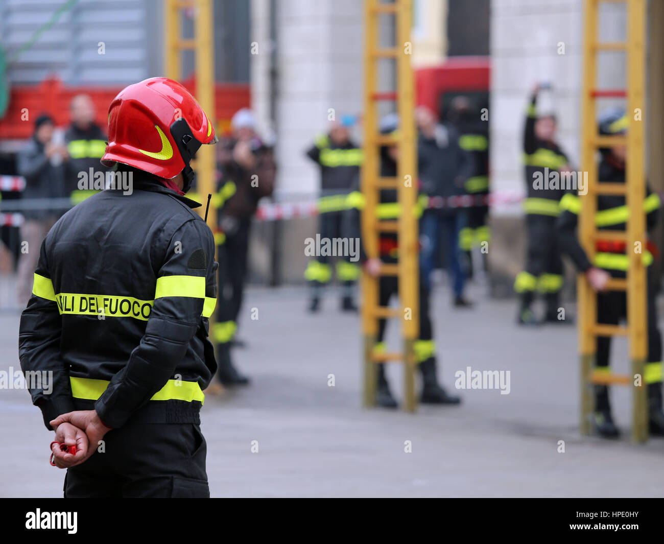 Italian firefighters during outdoor exercise with a wooden ladder Stock ...