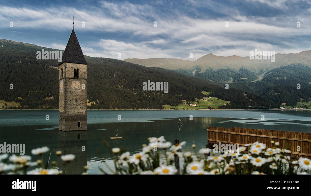bell tower of the submerged church in the lake of resia in trentino ...
