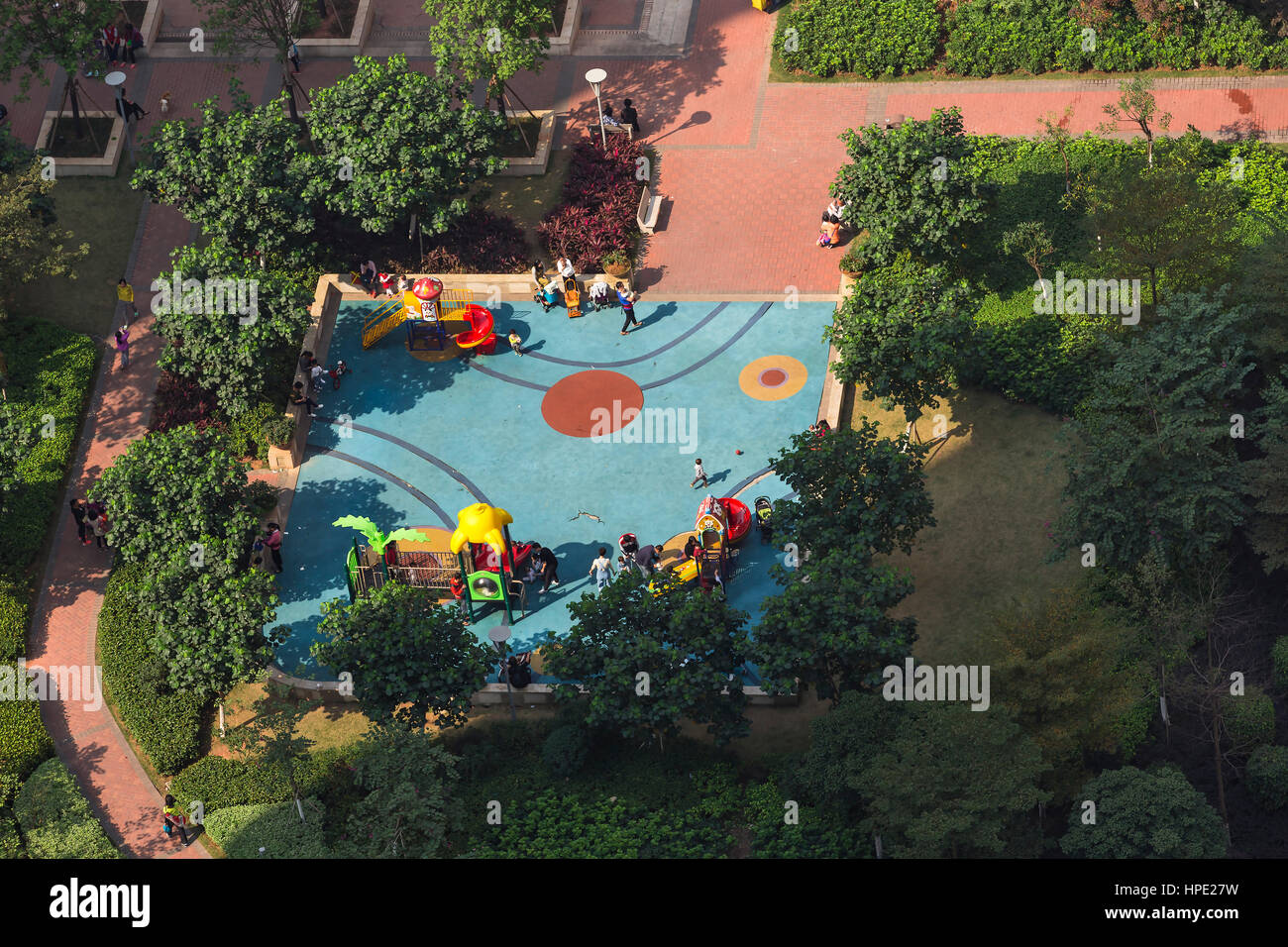 Guangzhou, China. February 2017. Kids playing at a playground in a city ...