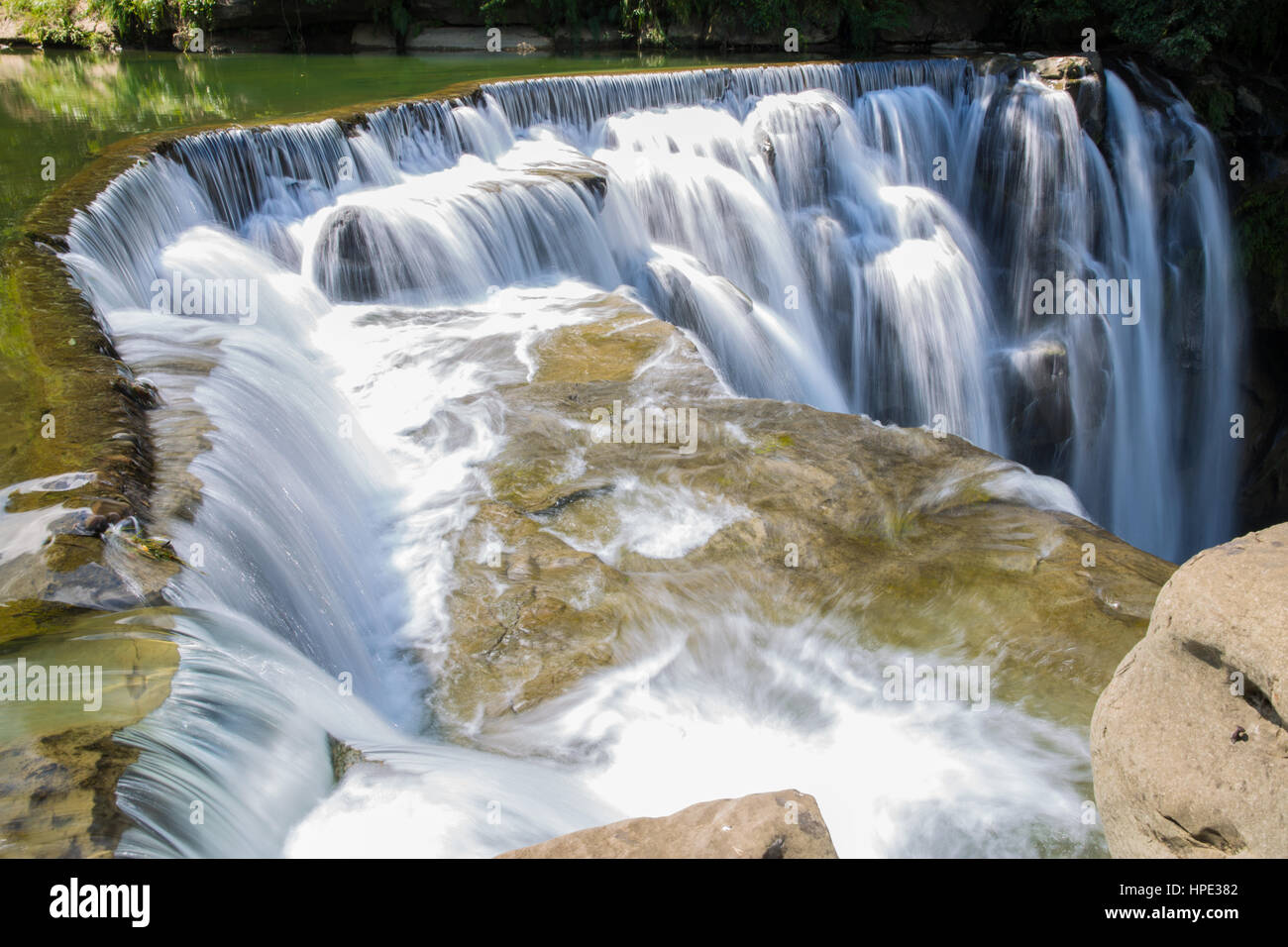 People under falling water hi-res stock photography and images - Alamy