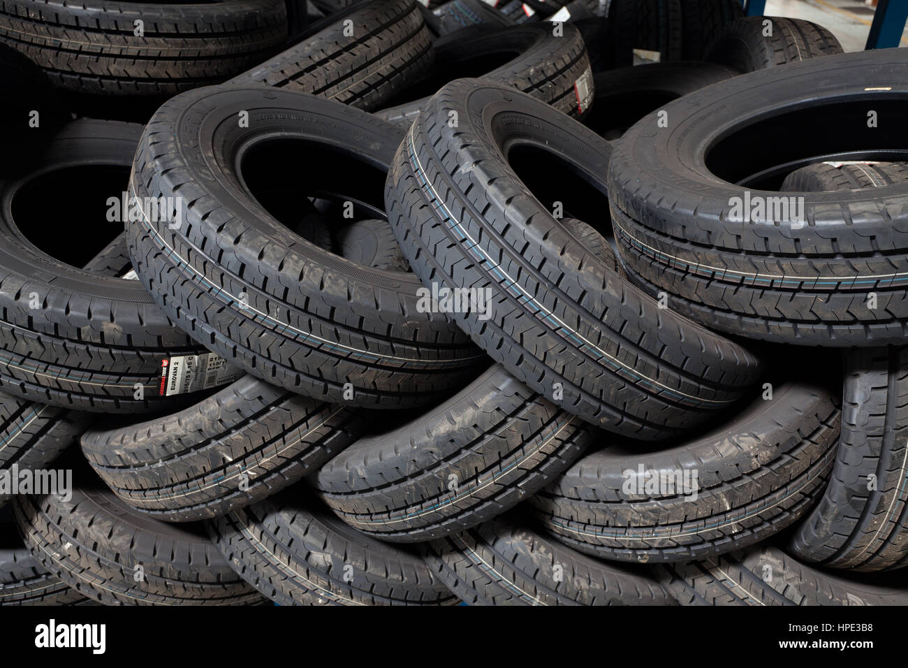 Tire stack in deposit storage Stock Photo - Alamy