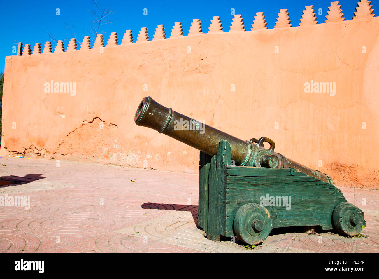in africa morocco green bronze cannon and the blue sky Stock Photo - Alamy
