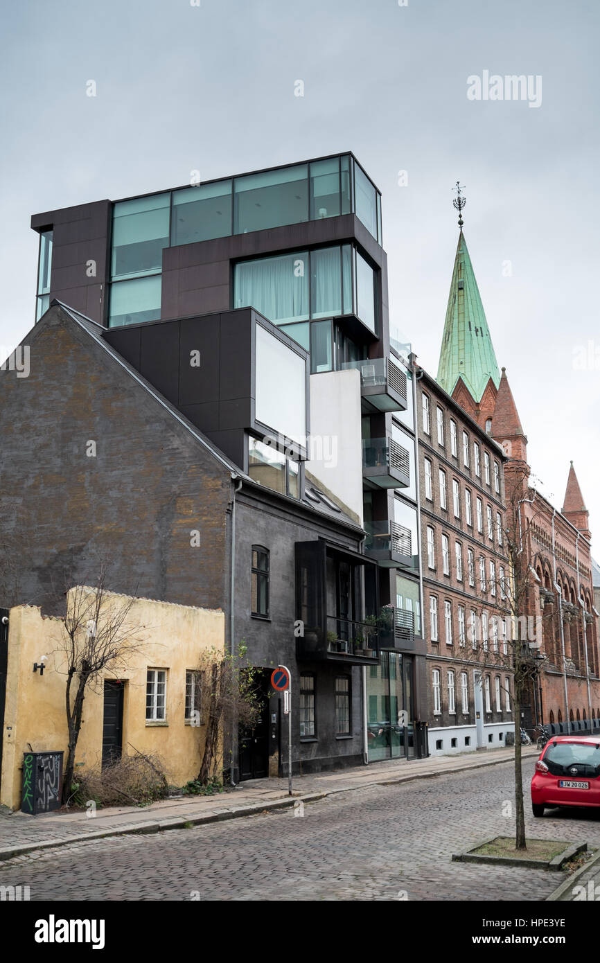 Street scene with modern house and traditional buildings side by side ...