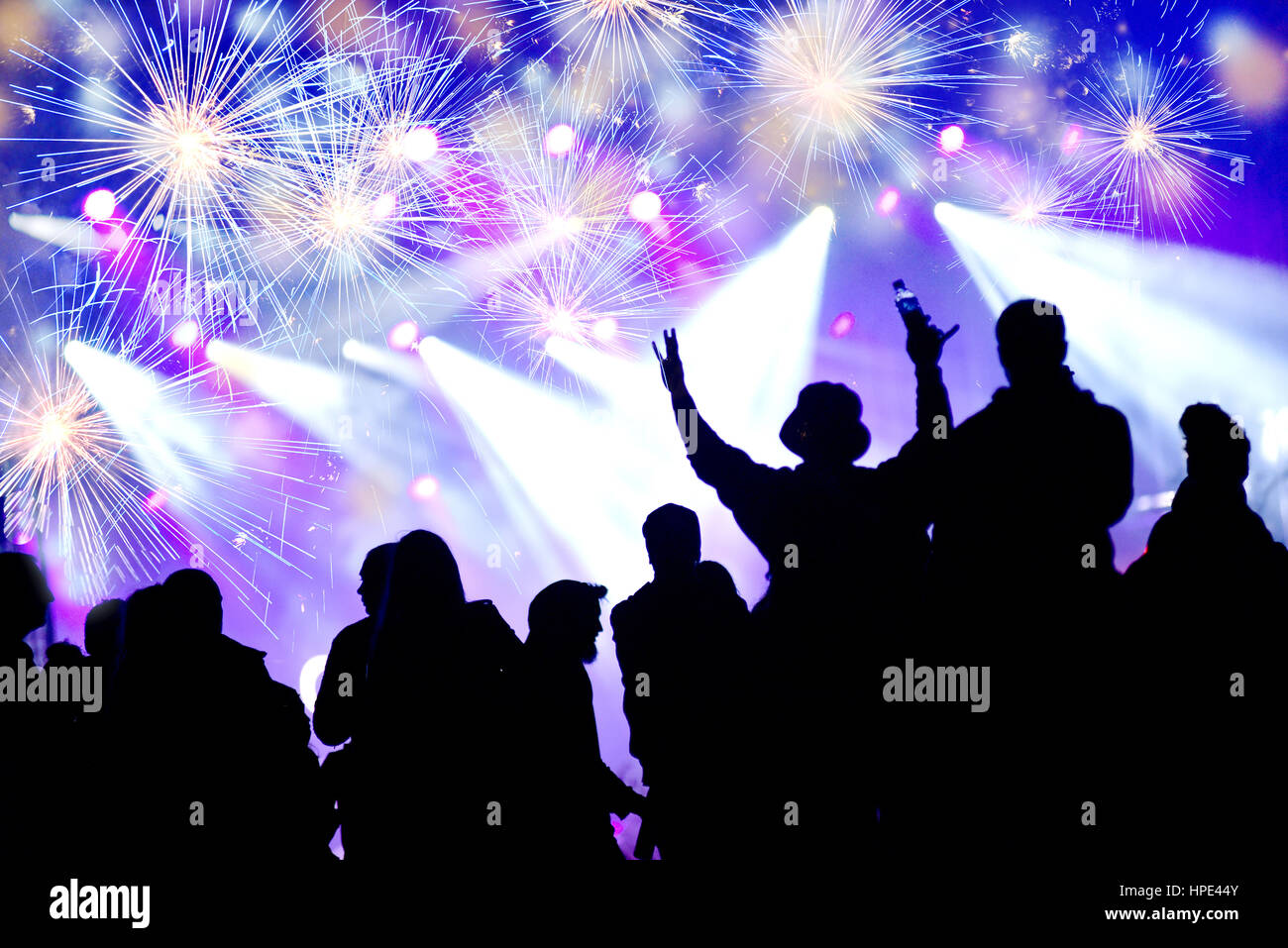 New Year concept with celebrating crowd and fireworks Stock Photo - Alamy
